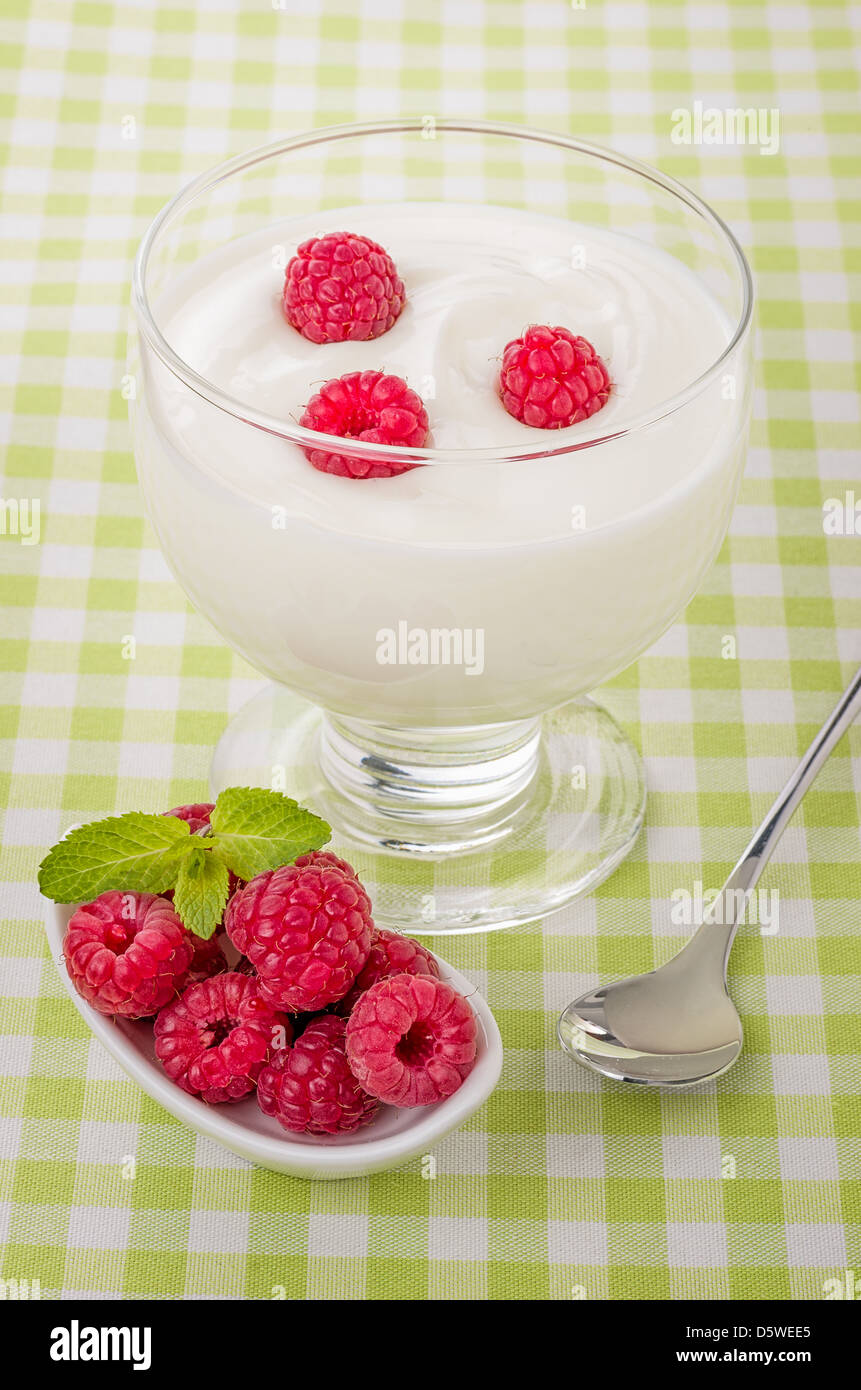 Fresh creamy natural yogurt with raspberries Stock Photo - Alamy