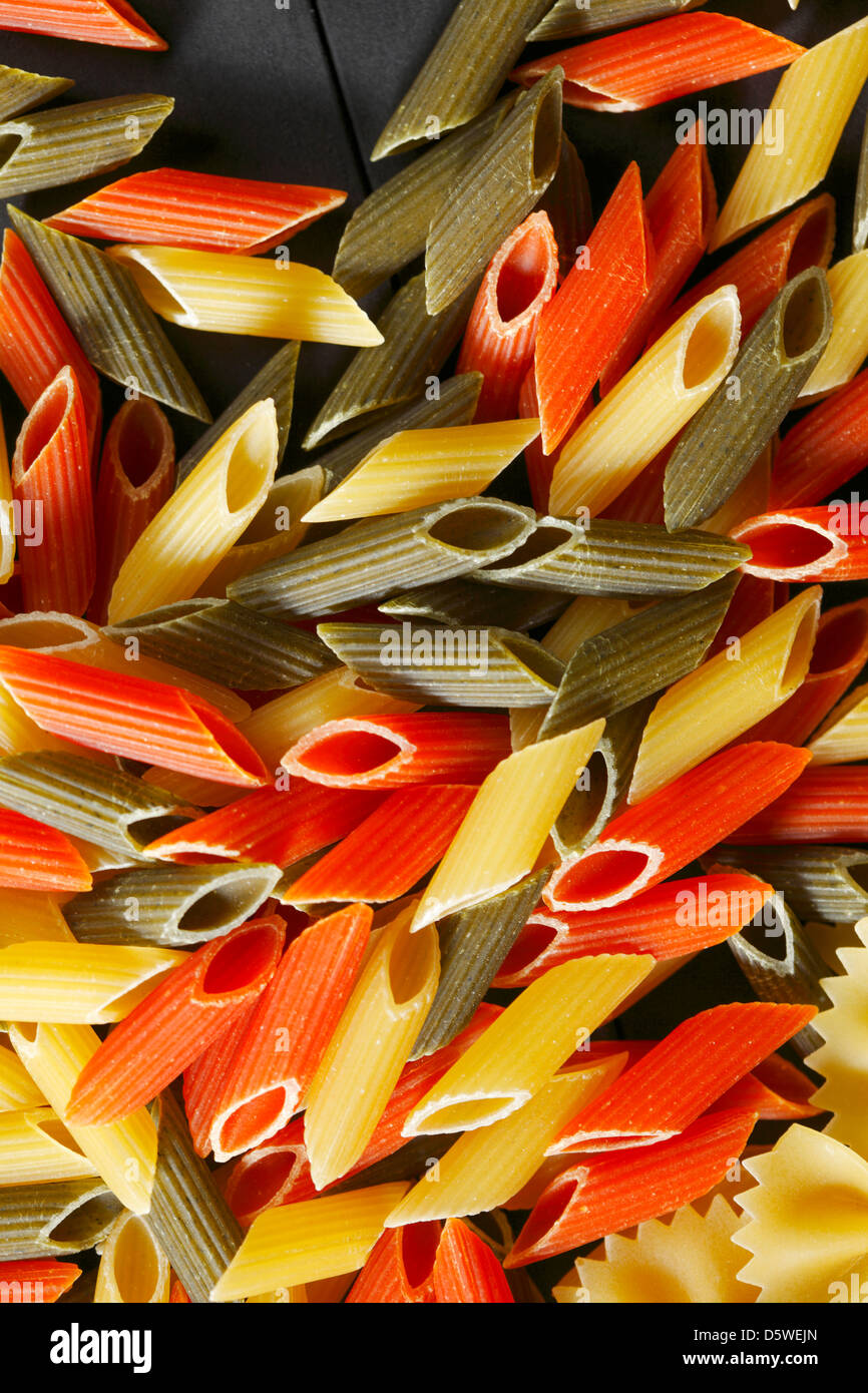 Variety of types and shapes of Italian pasta on black table Stock Photo ...