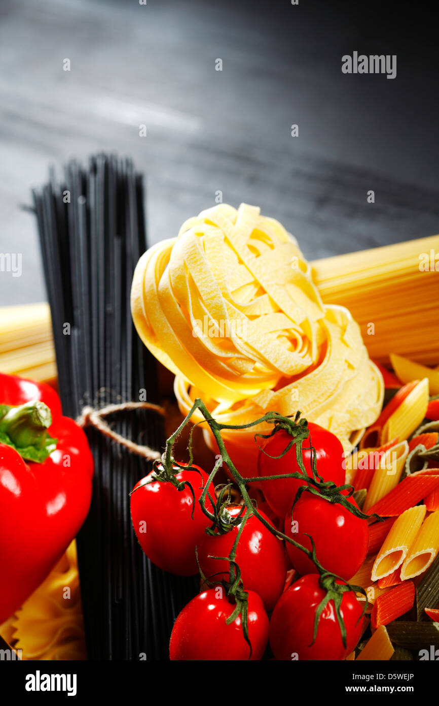 Pasta ingredients on black table, italian cuisine concept Stock Photo ...