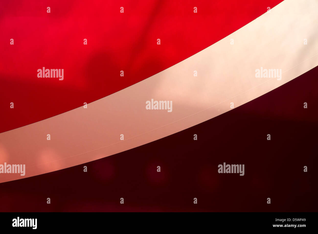 Art image of red painted panel with white curved stripe Stock Photo - Alamy