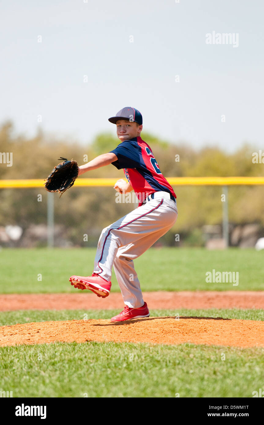 Teen baseball player throwing a pitch Stock Photo - Alamy