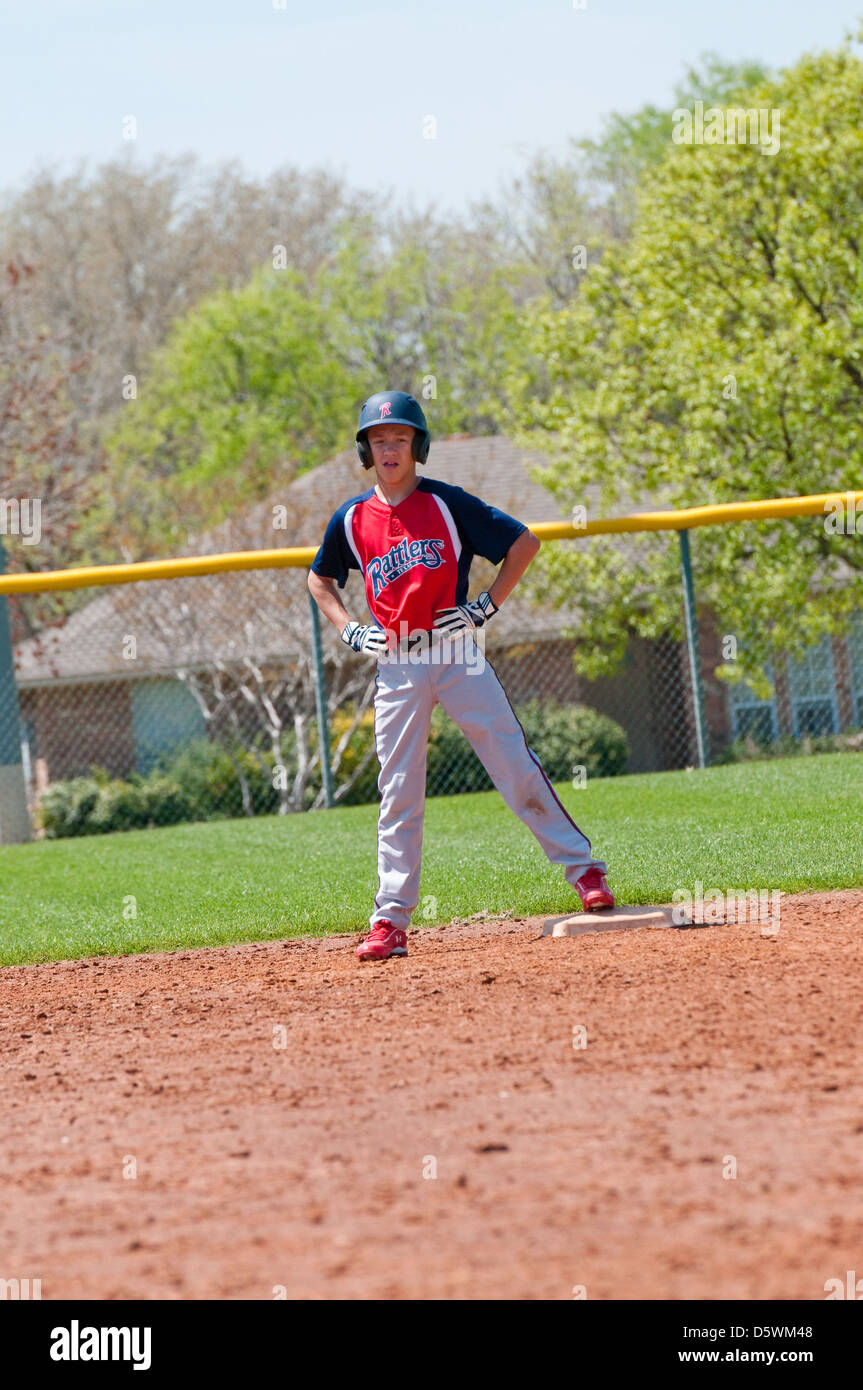 Baseball boy standing on base hi-res stock photography and images - Alamy