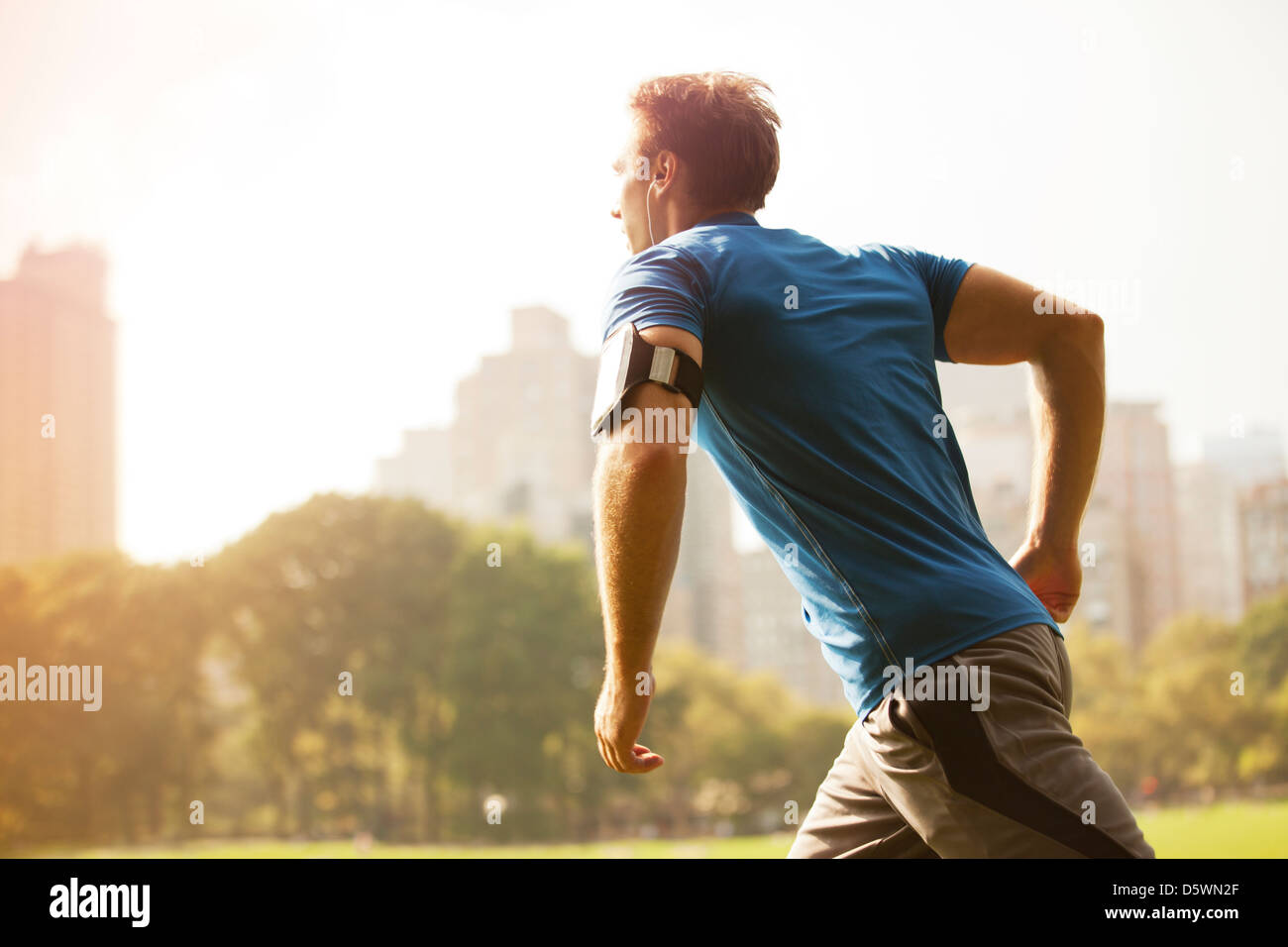 Jogger running in central park hi-res stock photography and images - Alamy