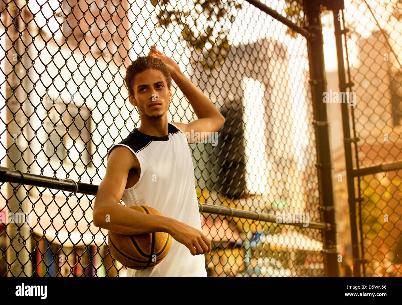 Man standing on basketball court Stock Photo - Alamy