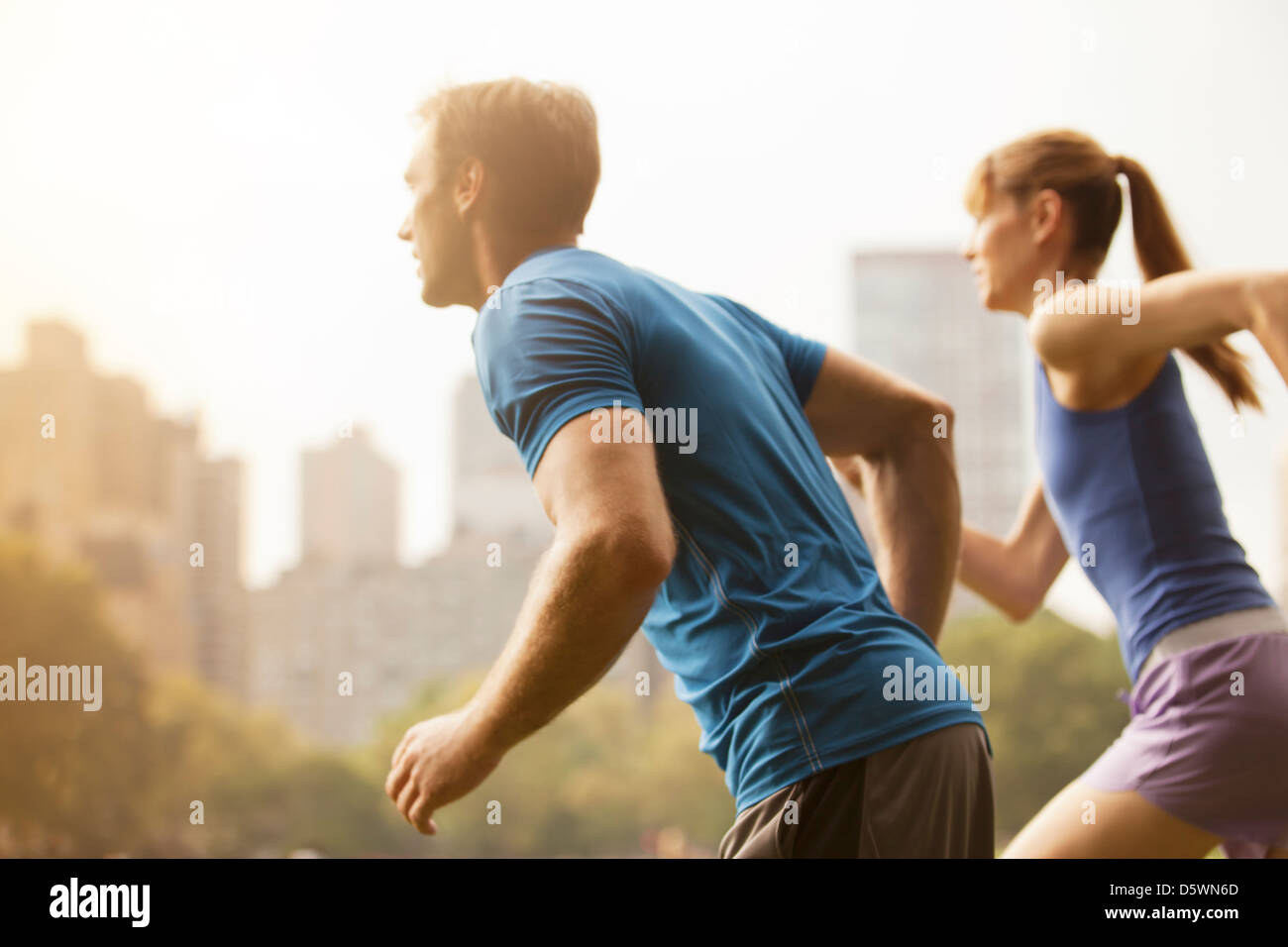 Woman running central park hi-res stock photography and images - Alamy