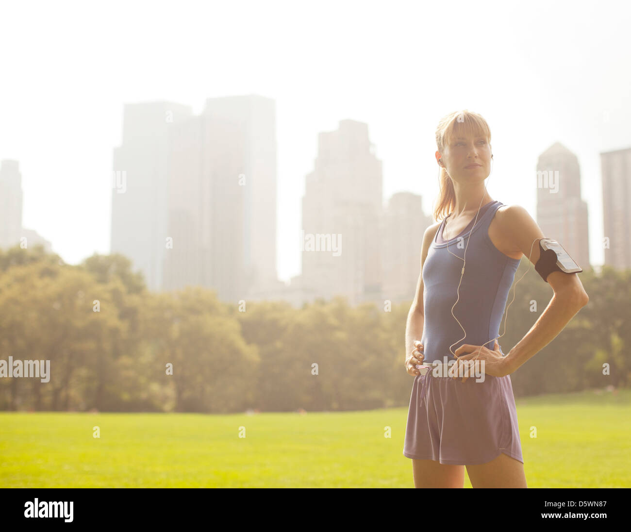 Runner standing in urban park Stock Photo - Alamy