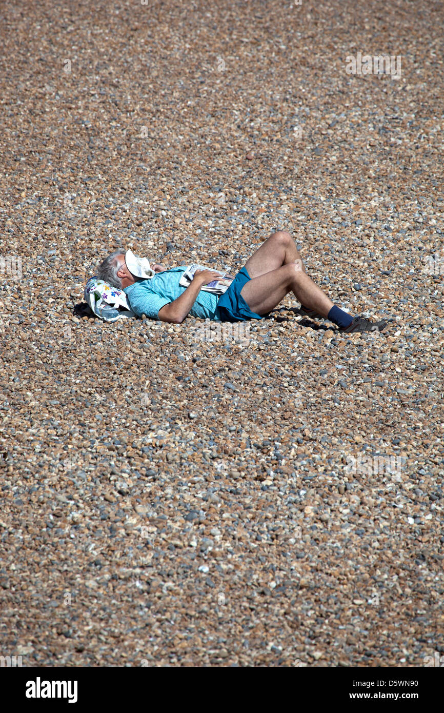Old man sunbathing on beach hi-res stock photography and images - Alamy