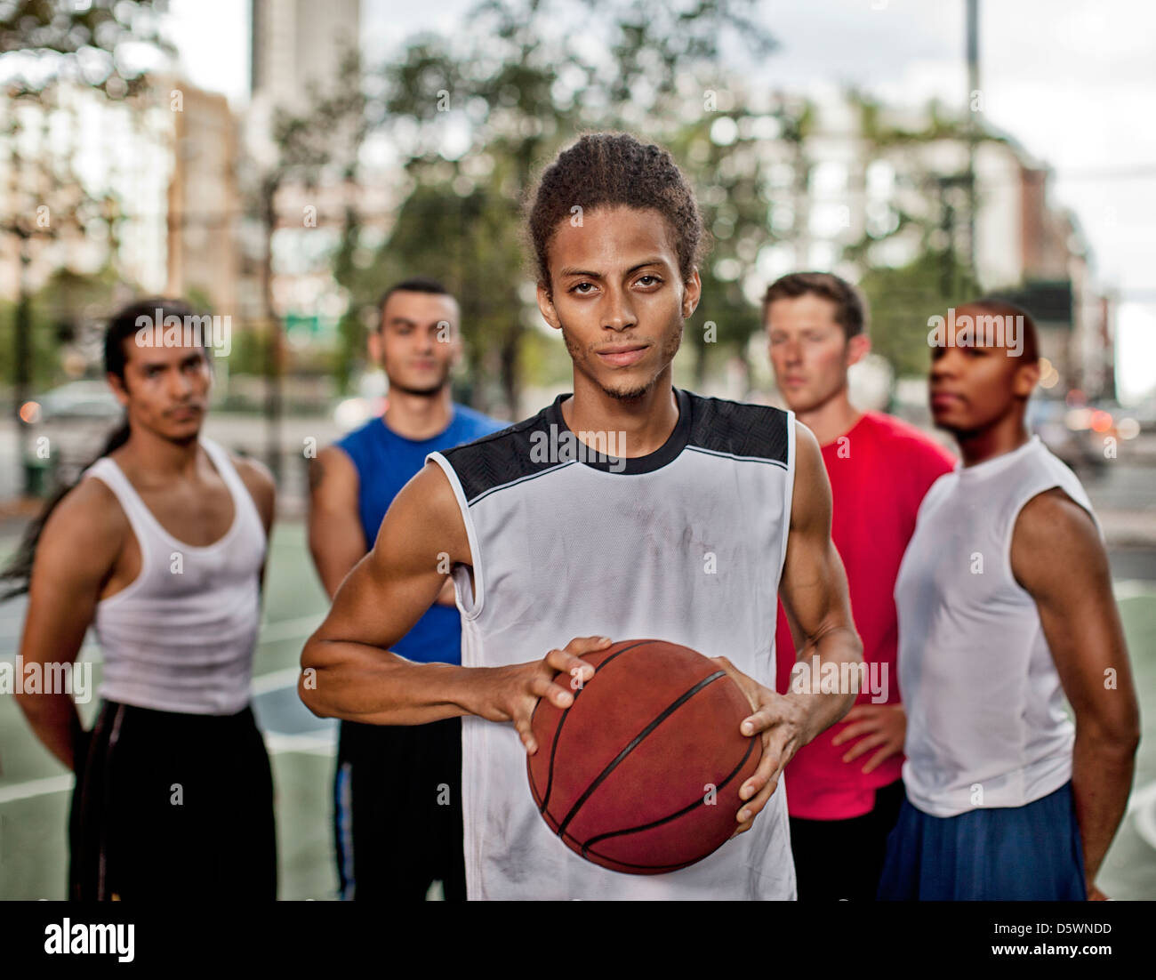 Men standing on basketball court Stock Photo - Alamy