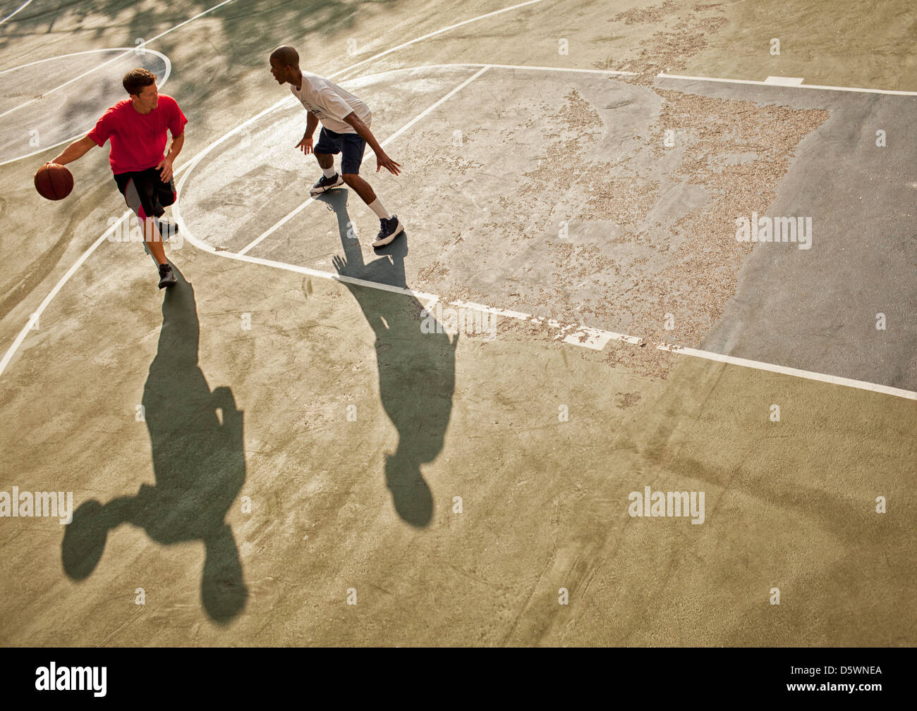 Men on basketball court bending hi-res stock photography and images - Alamy
