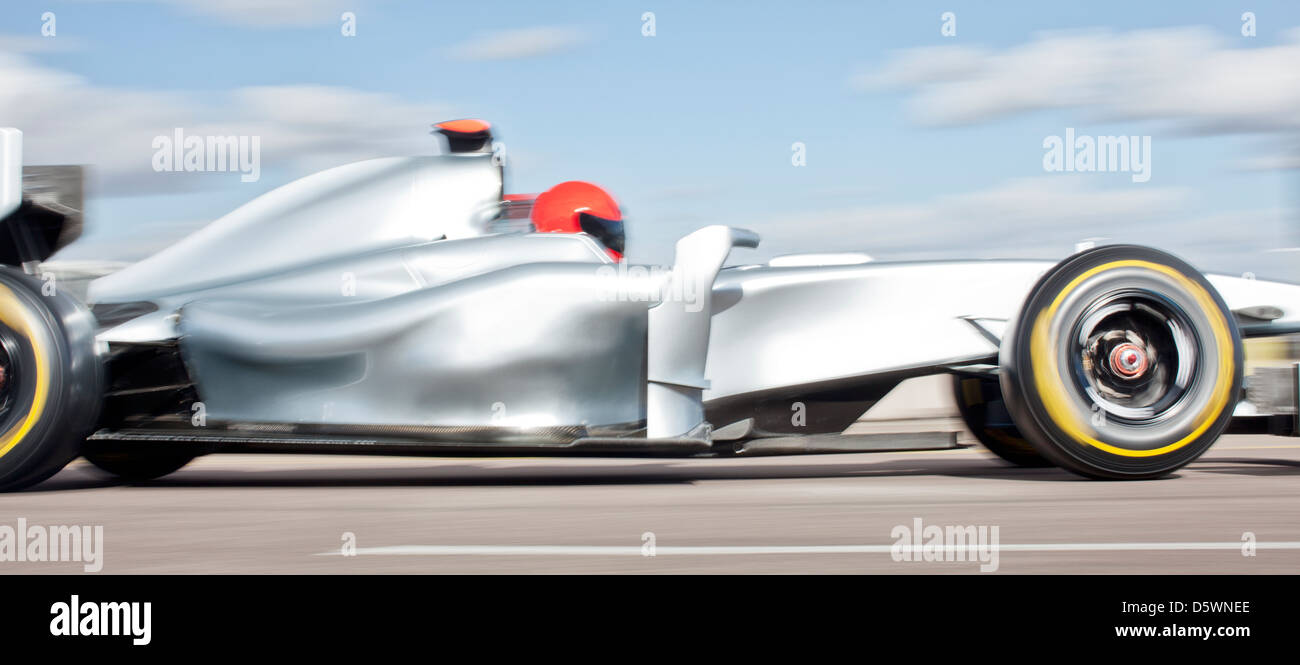 Race car driving on track Stock Photo - Alamy