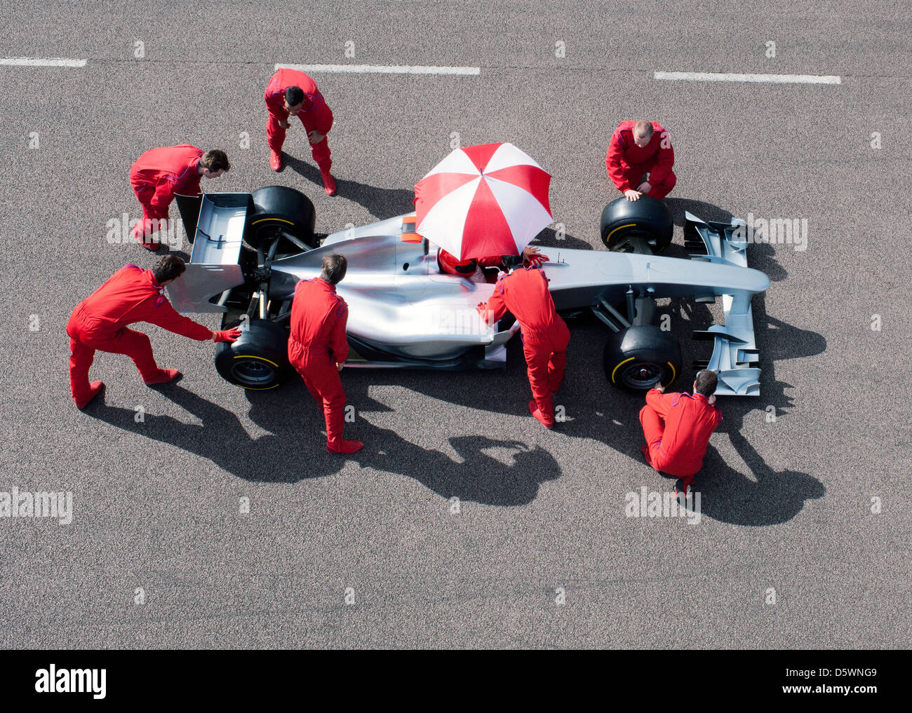 Racing team working at pit stop Stock Photo - Alamy