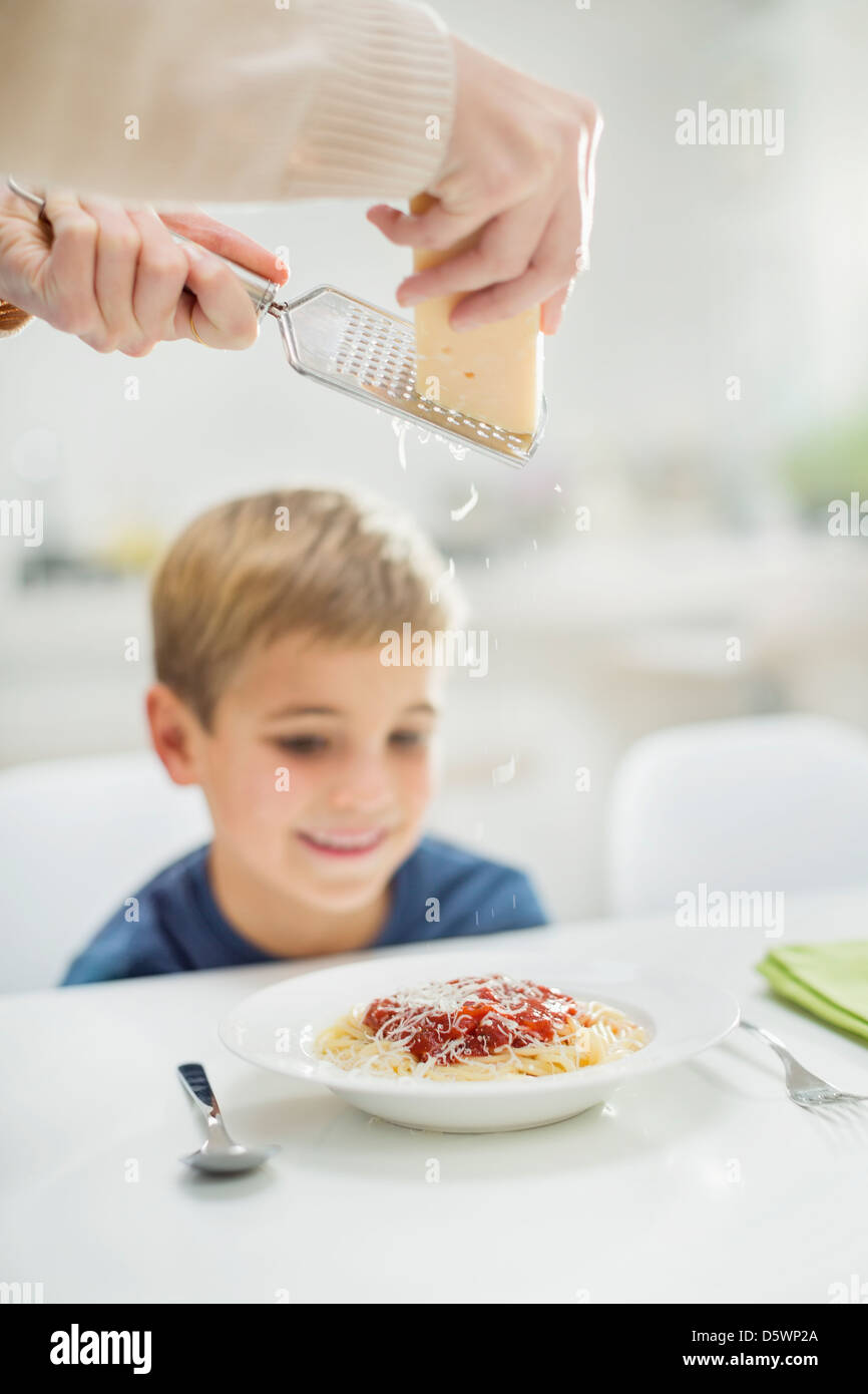 Grating cheese into sauce hi-res stock photography and images - Alamy