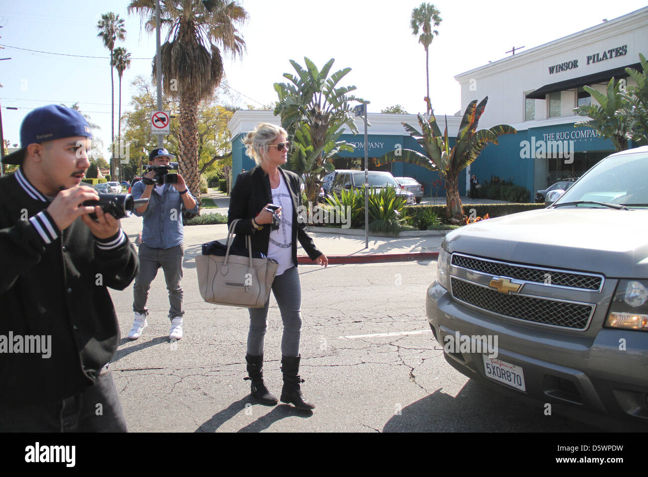 Rachel Hunter leaves Winsor Pilates. As she walks to her car, two ...