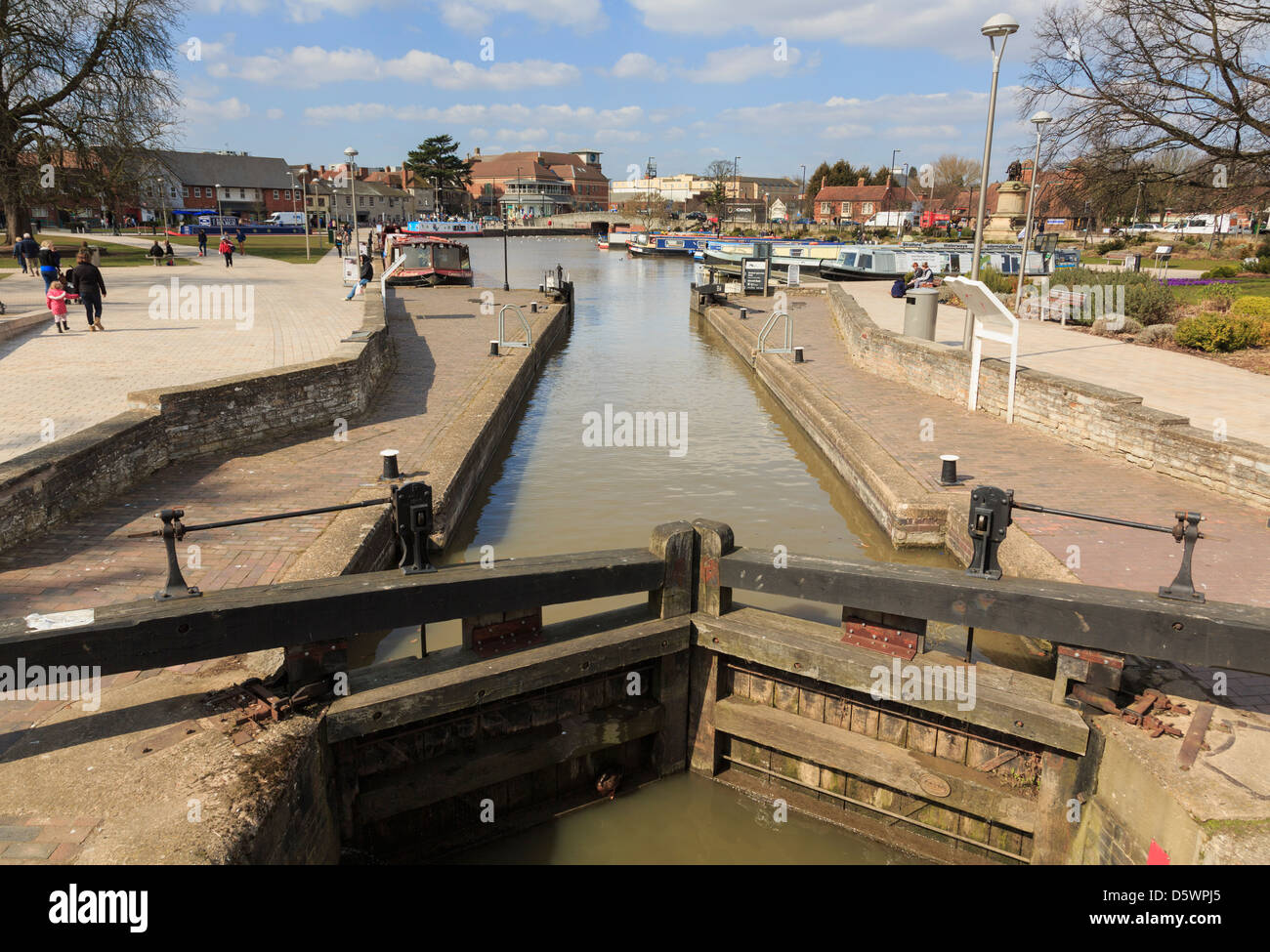 Lock gates to Bancroft canal basin with narrow boats moored near the ...