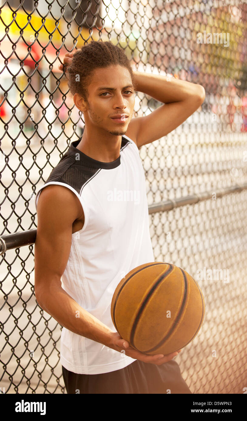 Man standing on basketball court Stock Photo - Alamy