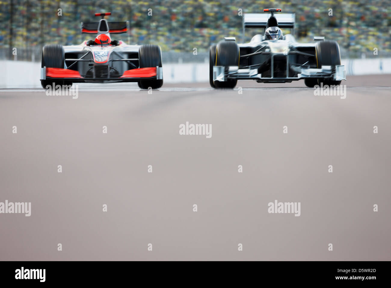 Race cars driving on track Stock Photo - Alamy