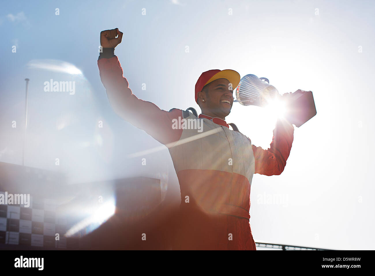 Race car winner holding up trophy hi-res stock photography and images ...