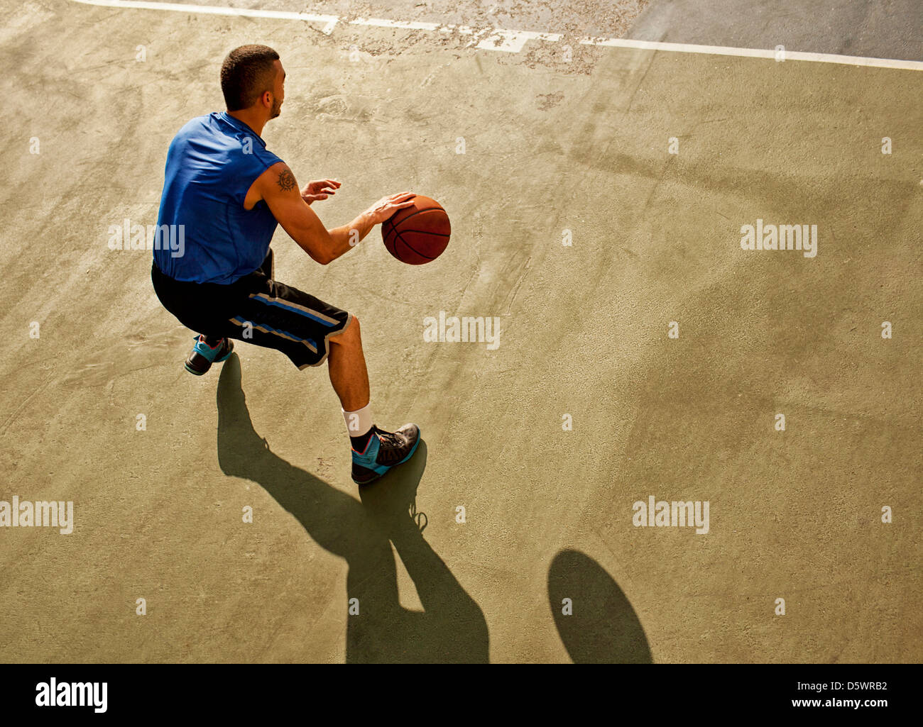 Young casual man bouncing basketball hi-res stock photography and ...