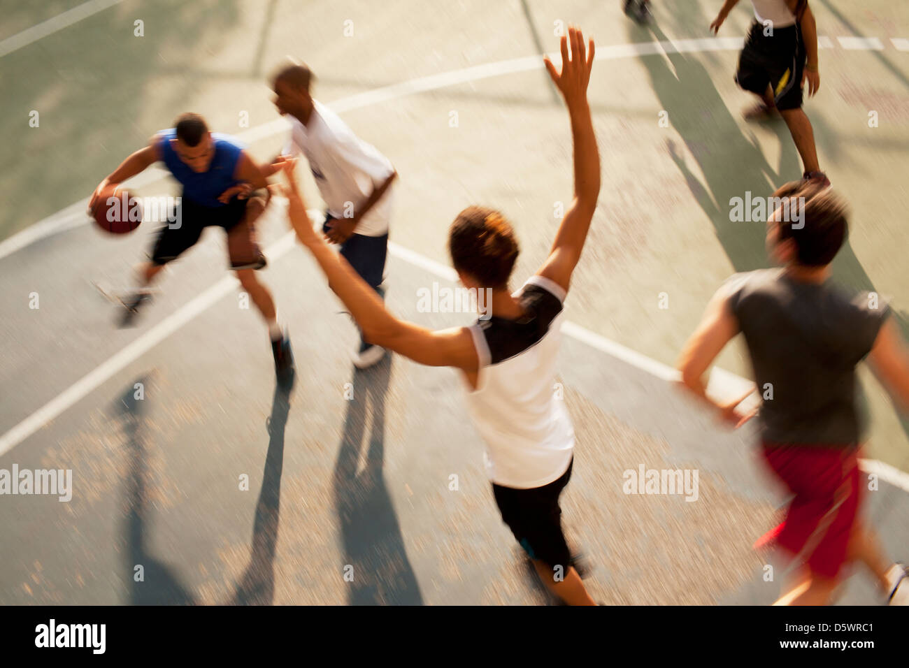 Men playing basketball on court Stock Photo - Alamy