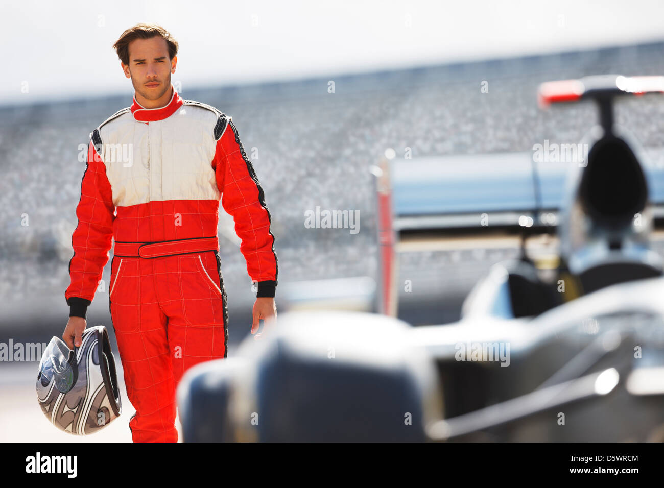 Race car driver holding helmet hi-res stock photography and images - Alamy