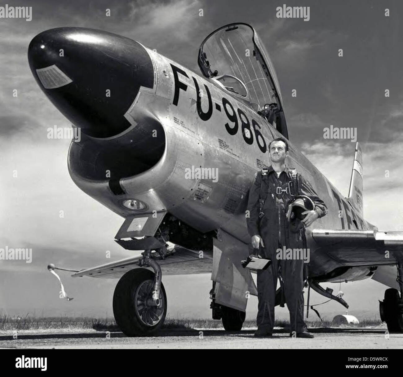 NACA Test Pilot George E. Cooper is shown alongside a North American F ...