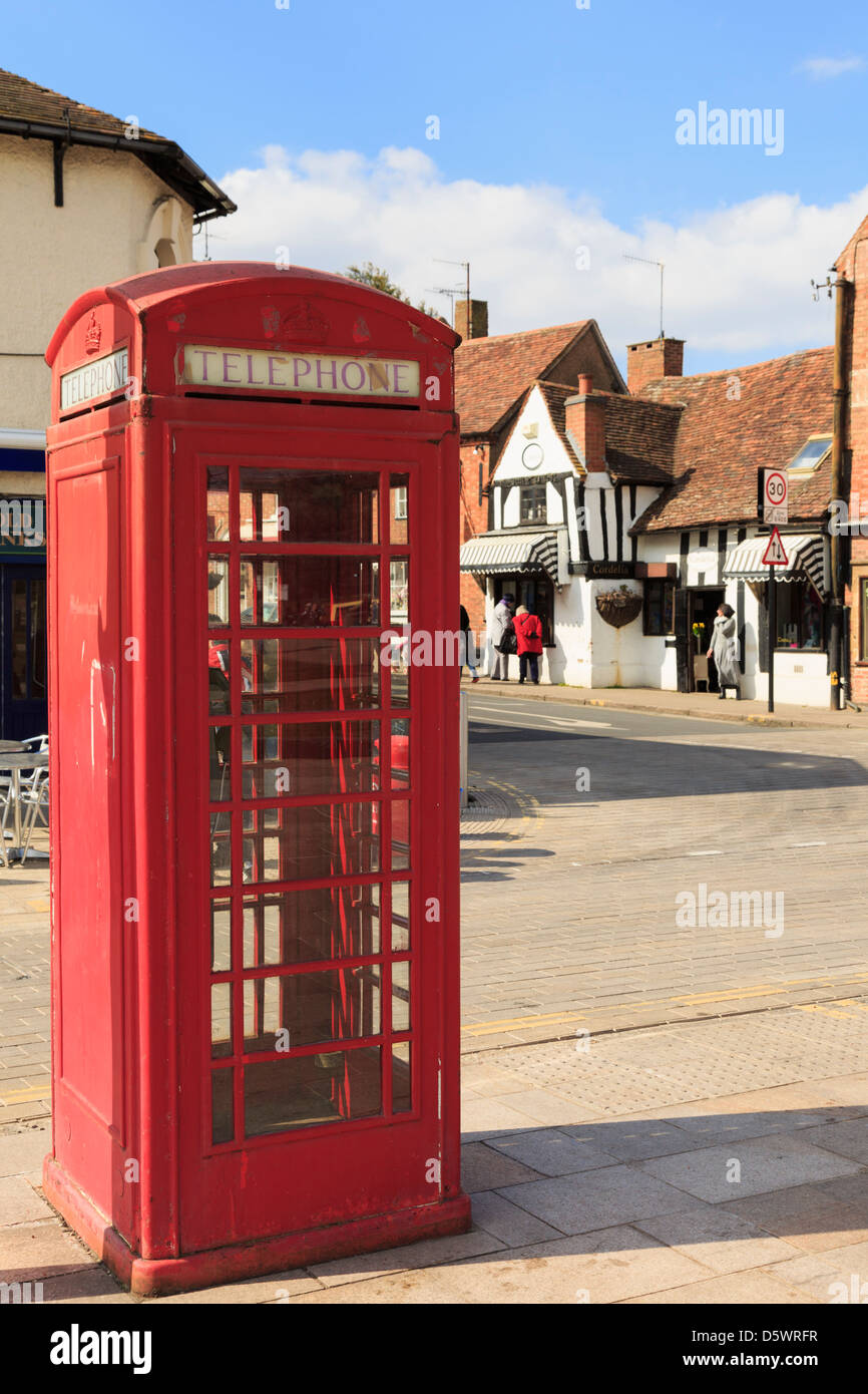 Traditional red public telephone box kiosk (K6) on a street in ...
