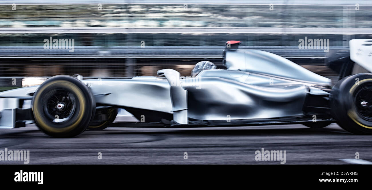 Race car driving on track Stock Photo - Alamy