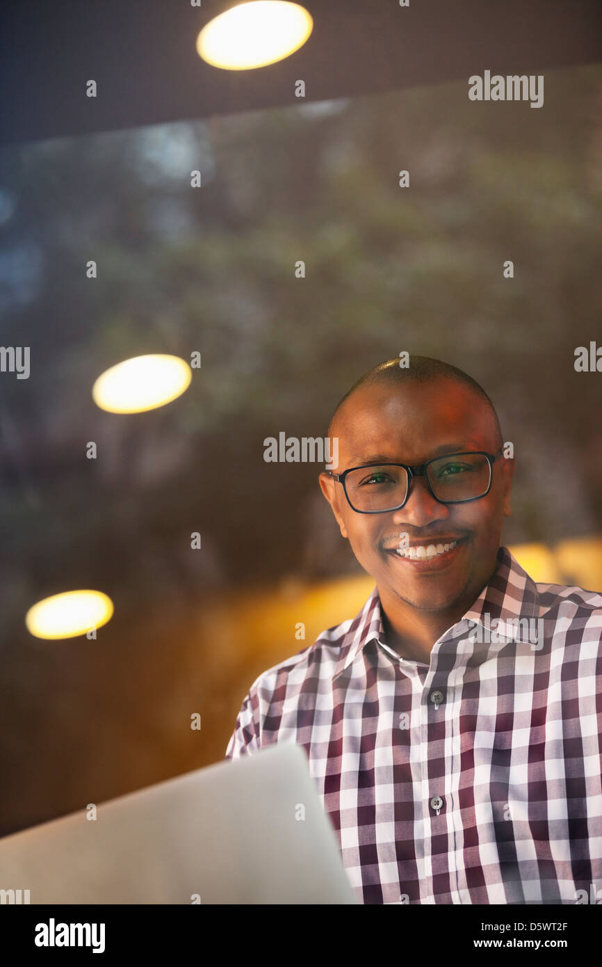 Man carrying papers indoors Stock Photo - Alamy