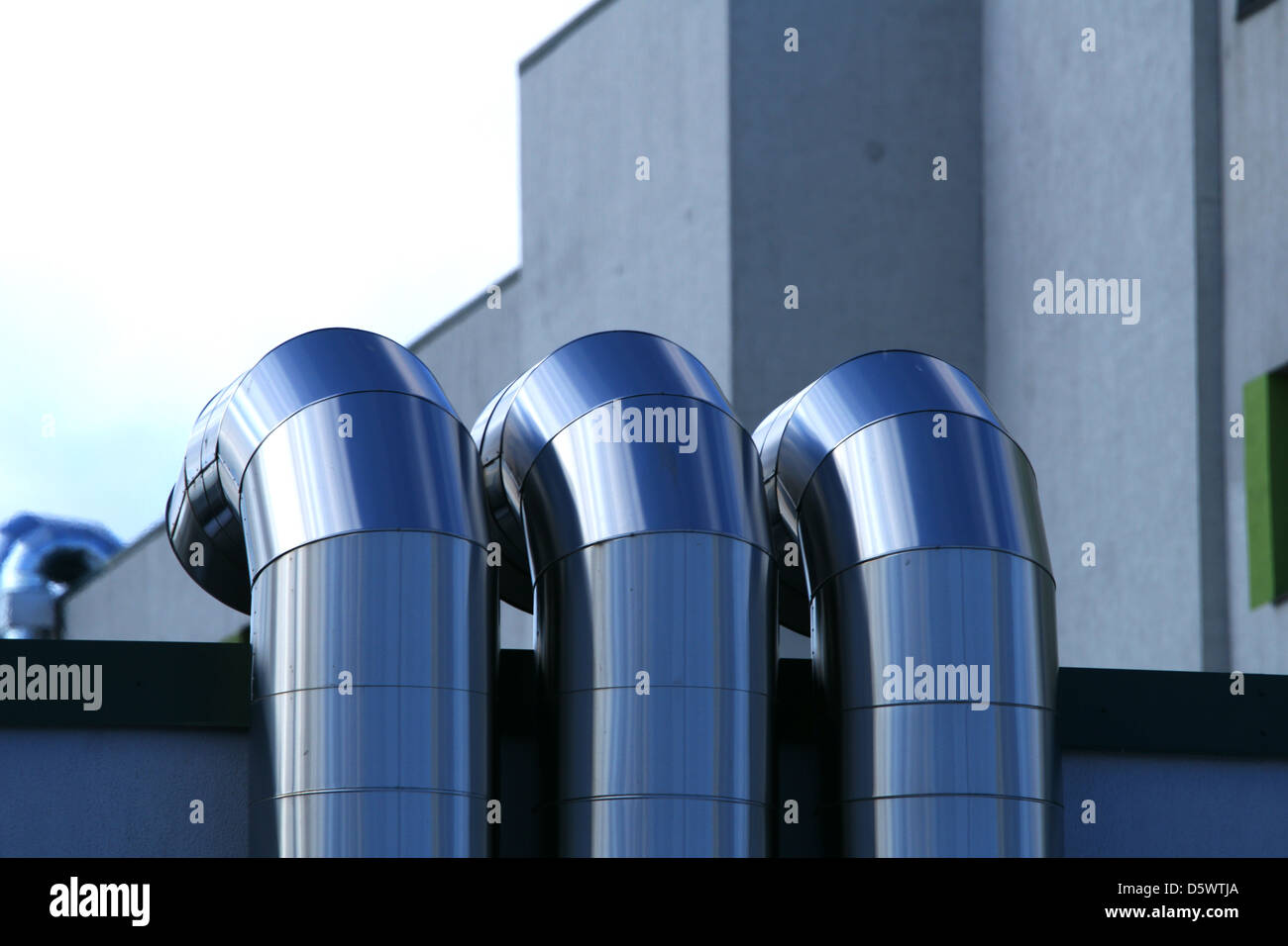 Metal pipes are located in one line Stock Photo - Alamy