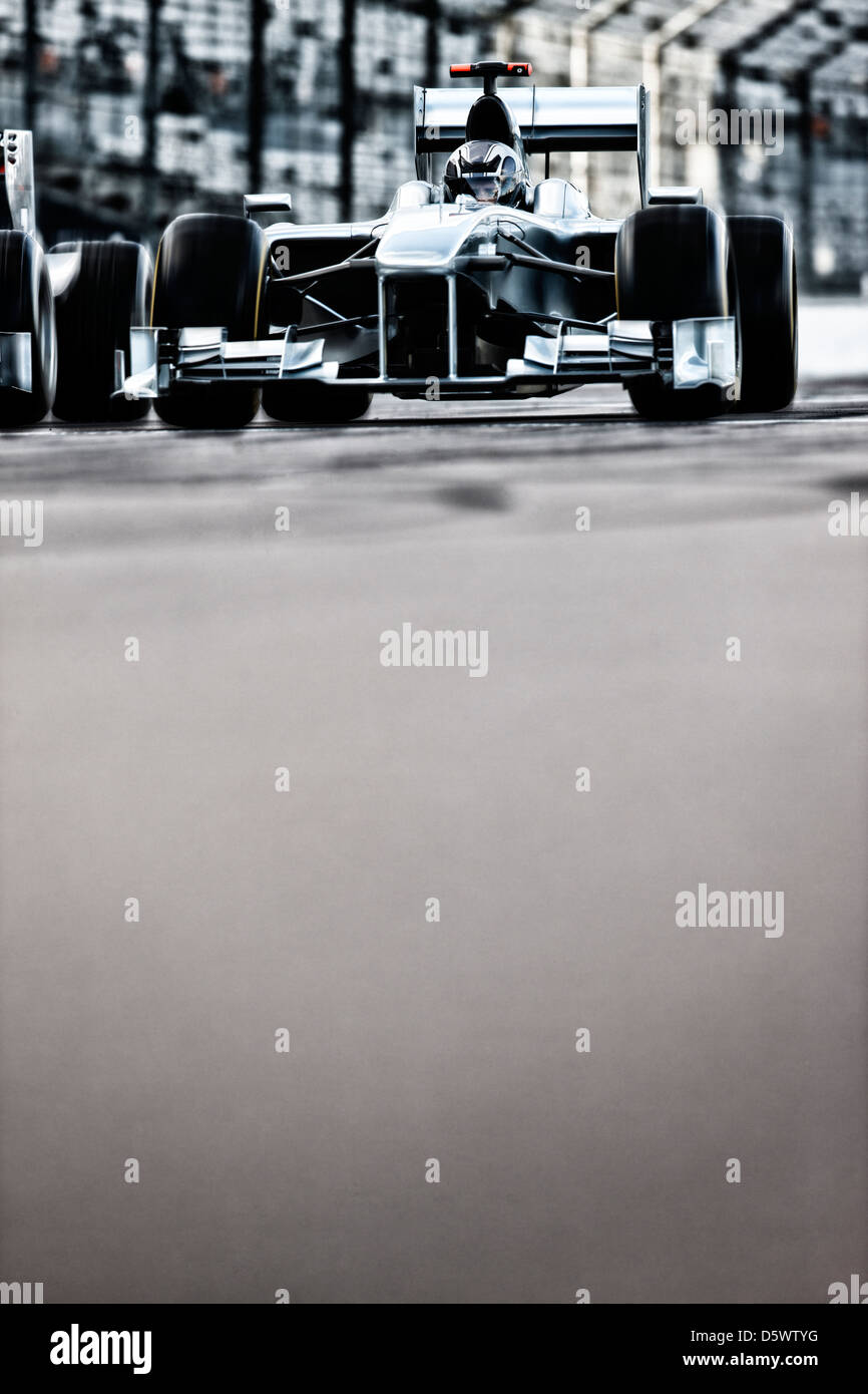 Race car driving on track Stock Photo - Alamy