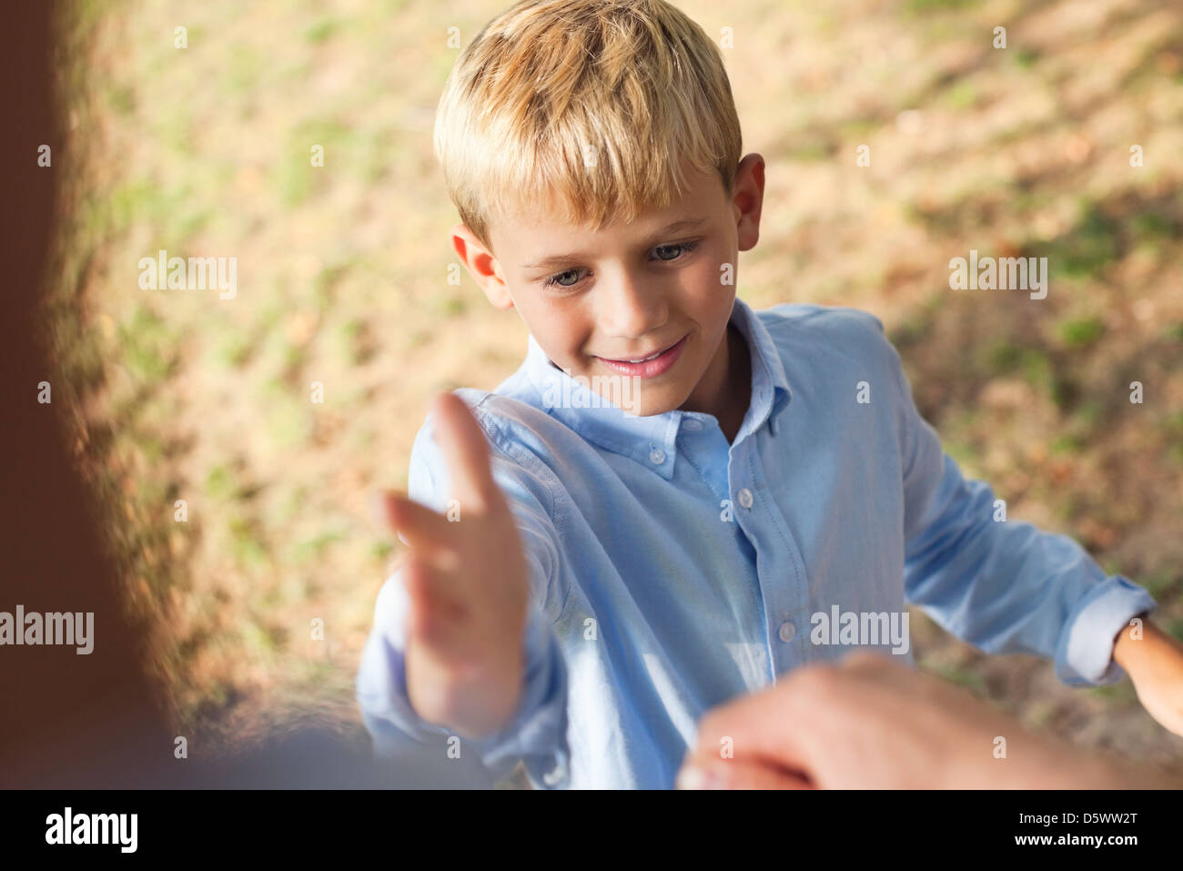 Boy high fiving hi-res stock photography and images - Alamy