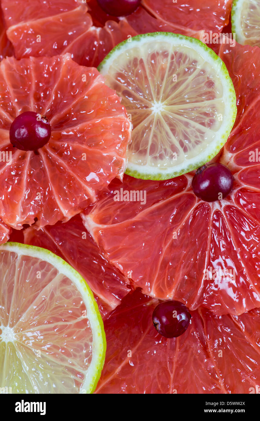 Citrus slices background - grapefruit and lime, vertical Stock Photo ...