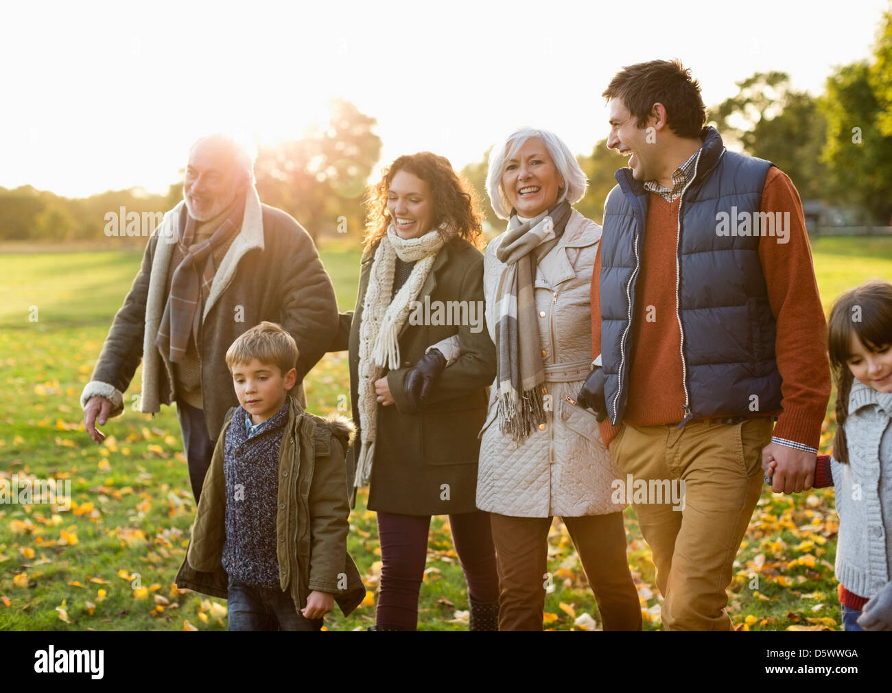 Family walking together in park Stock Photo - Alamy