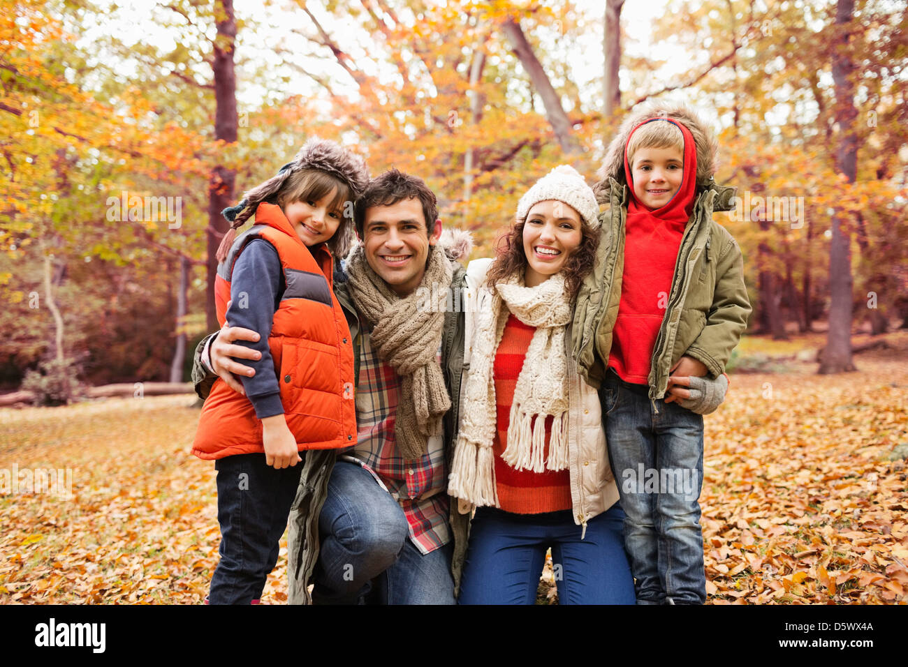 Family smiling together in park Stock Photo - Alamy