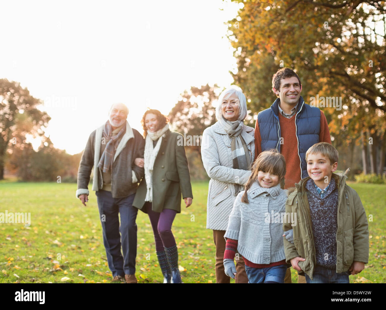 Family walking together in park Stock Photo - Alamy