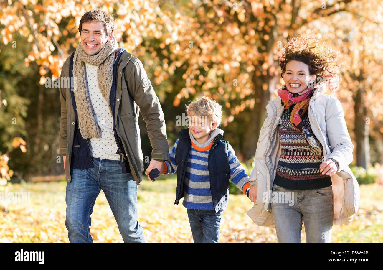 Family walking together in park Stock Photo - Alamy