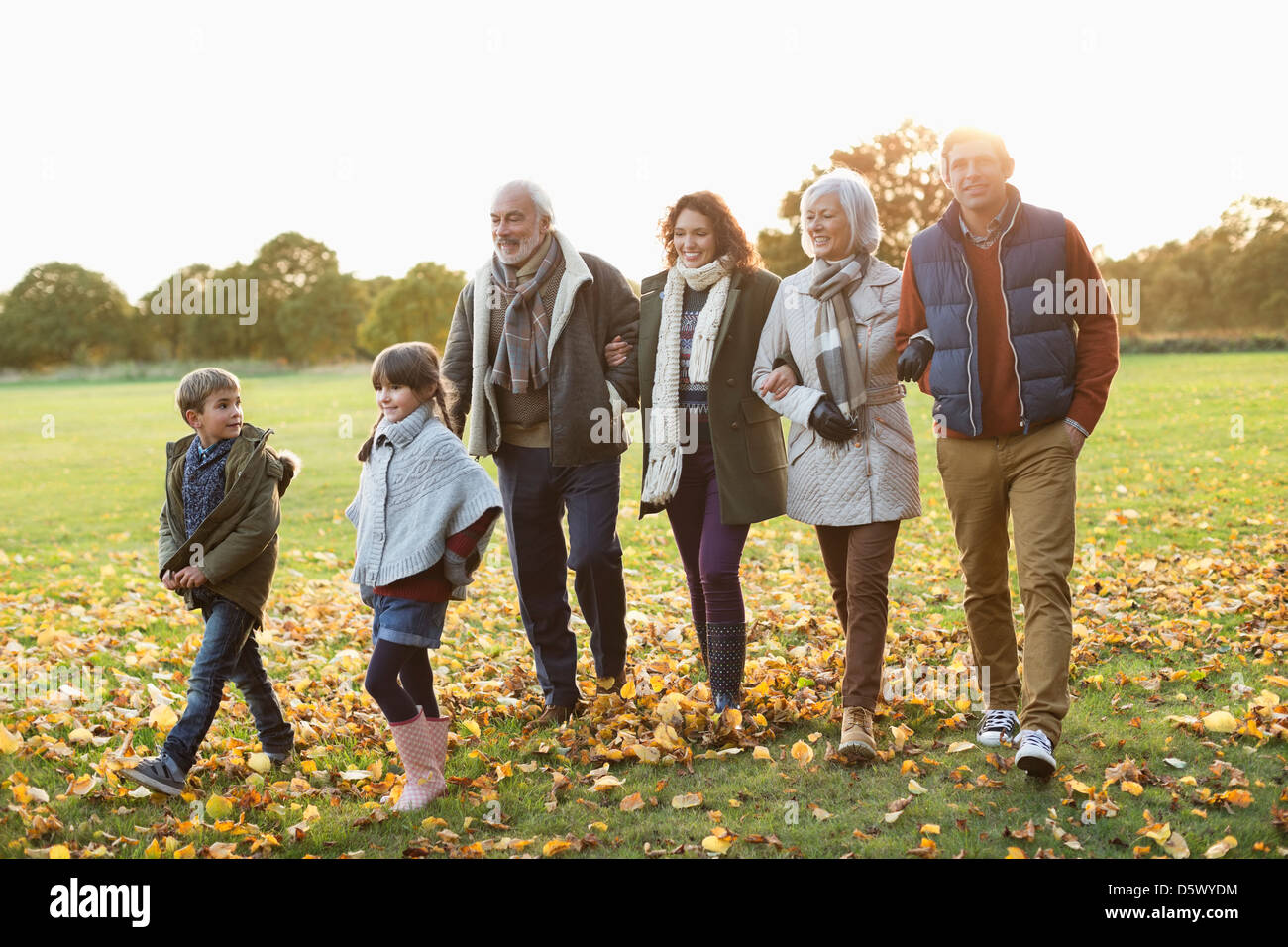 Family walking together in park Stock Photo - Alamy