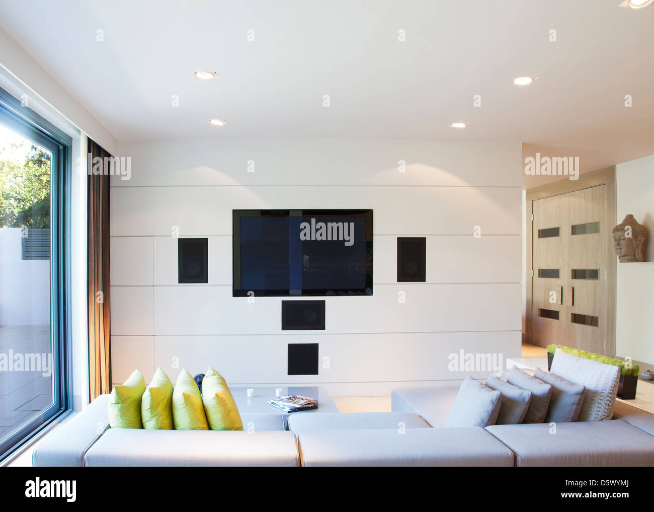 Sofa and television in modern living room Stock Photo - Alamy