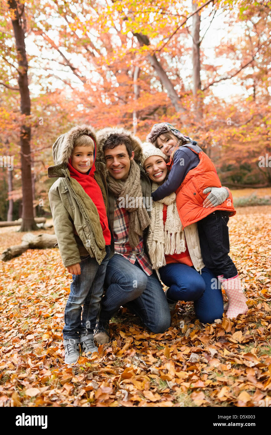 Family smiling together in park Stock Photo - Alamy