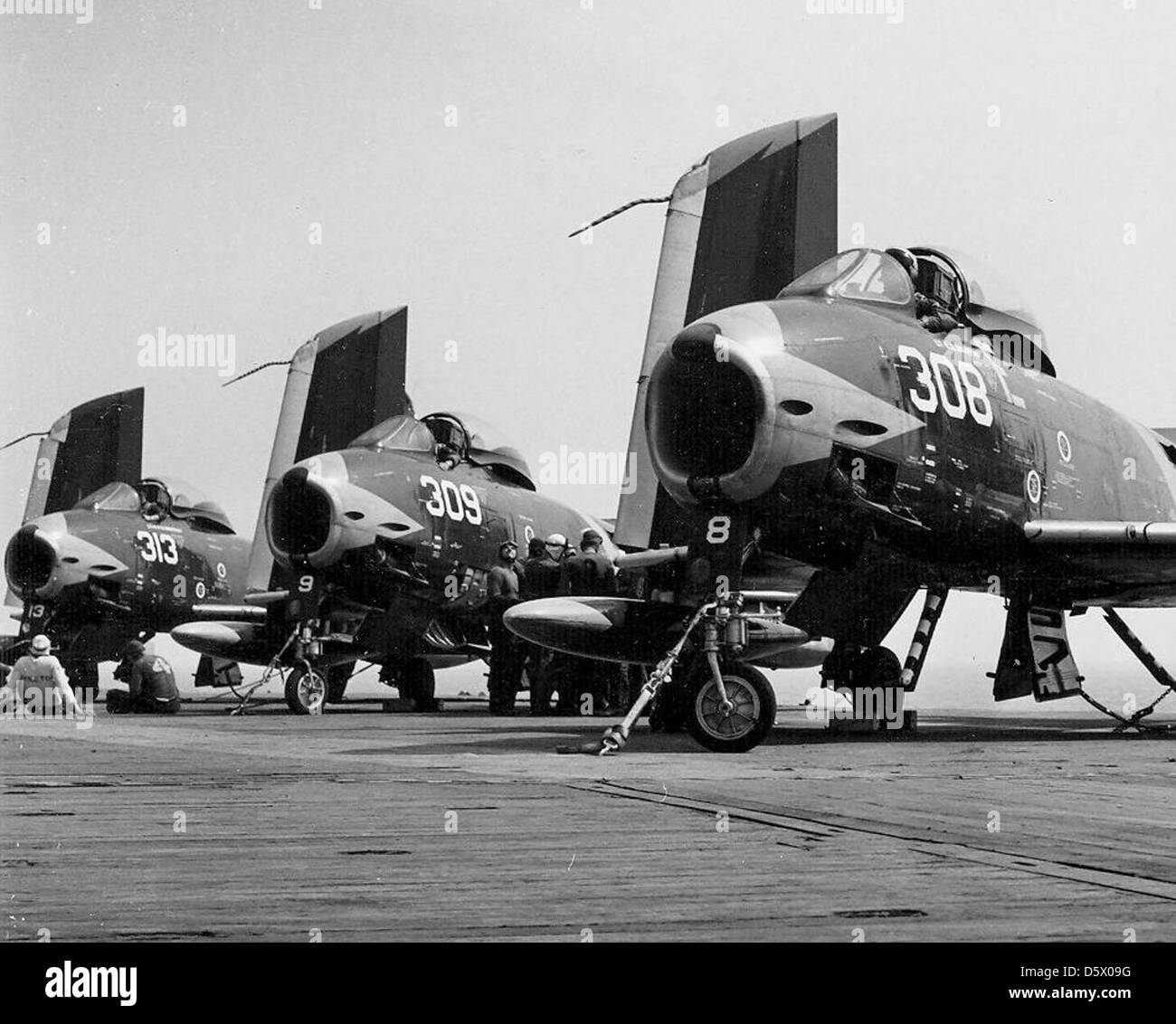 North American FJ-3 'Fury' fighter jets of VF-173 are seen on the deck ...