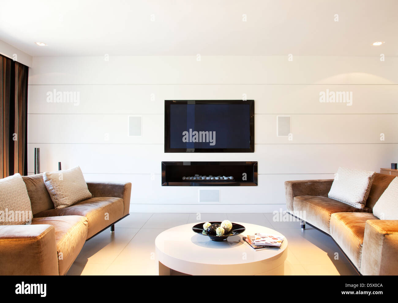 Sofa and television in modern living room Stock Photo - Alamy