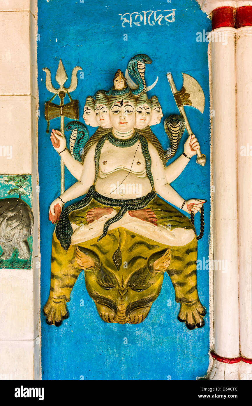 High relief painted mural on an exterior wall at a sattra, monastery ...