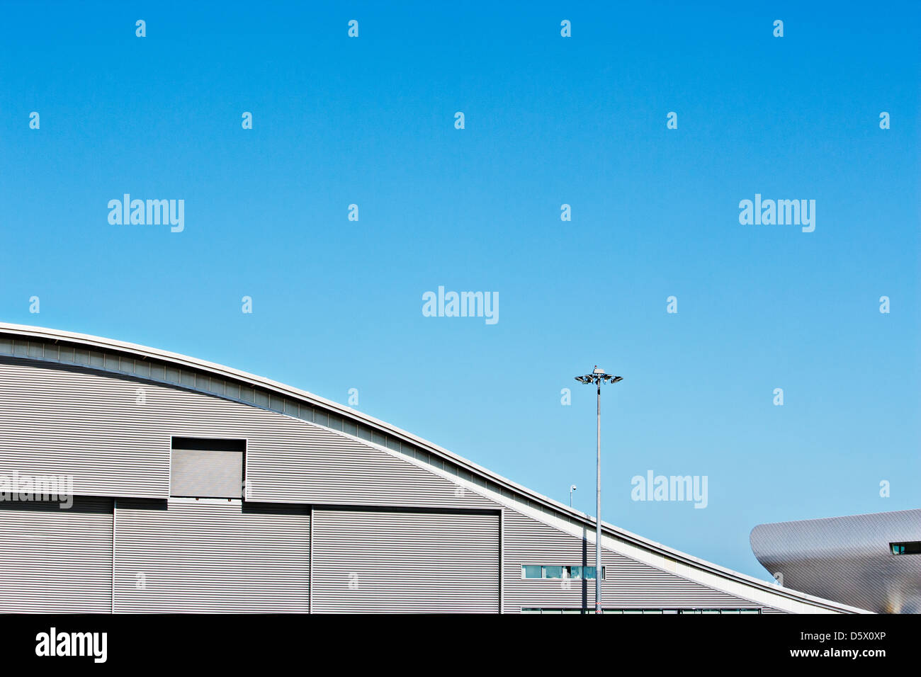Curved roof and blue sky Stock Photo - Alamy