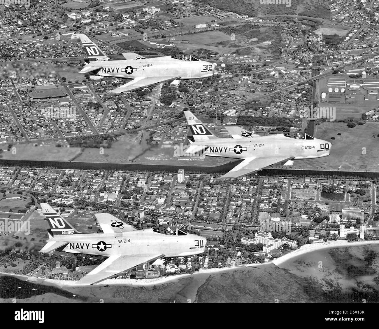 North American FJ-4B 'Furys' of VA-214 fly over Waikiki Beach, Hawaii, on February 19, 1958. The ...