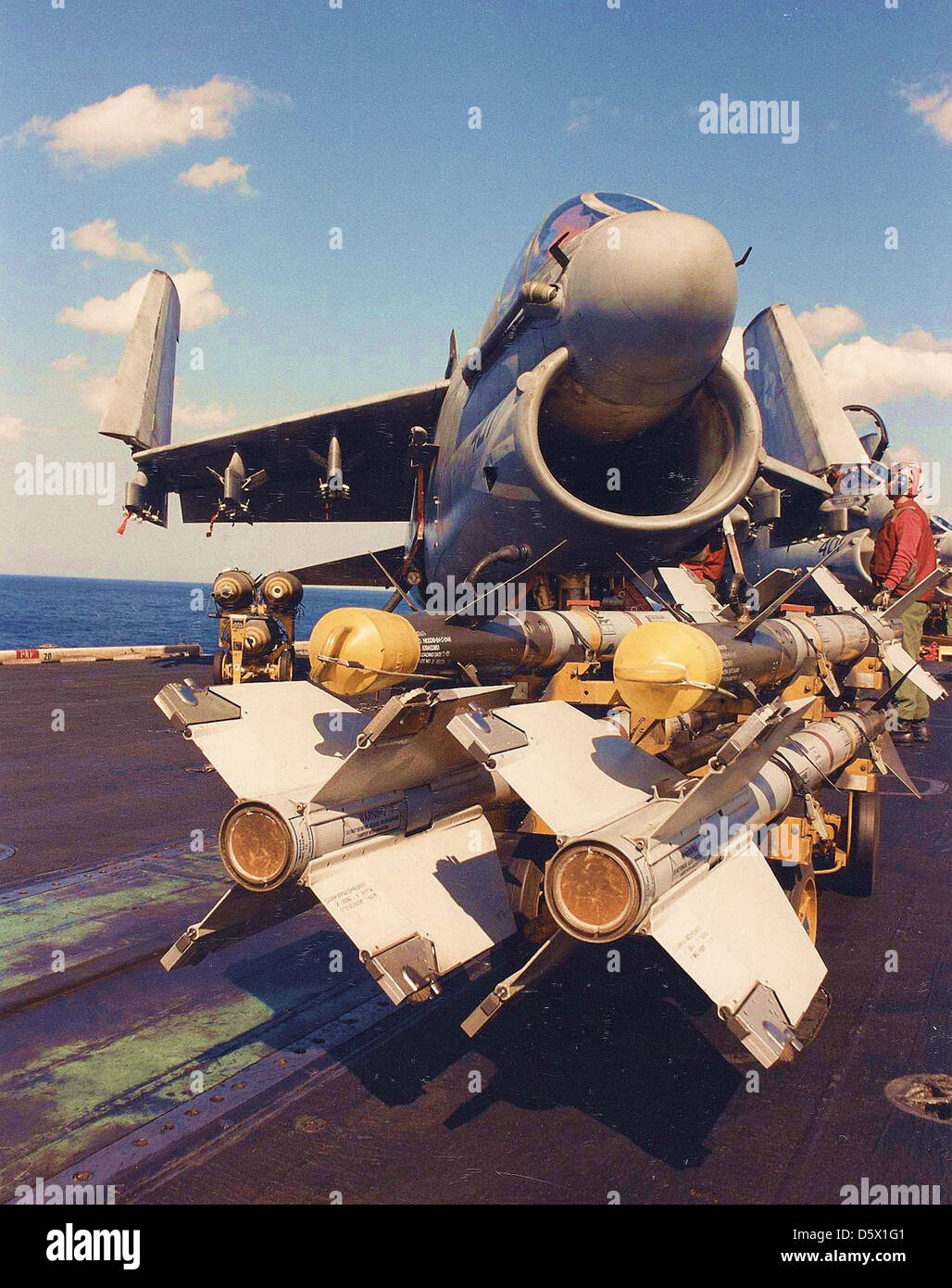 AIM-9 Sidewinder missiles on a cart ready for loading on the flight ...