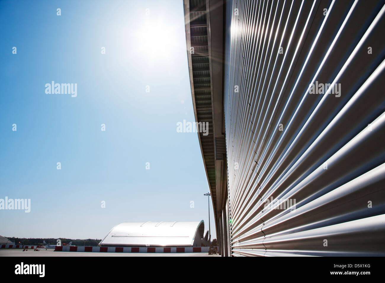 Close up of warehouse wall and blue sky Stock Photo - Alamy