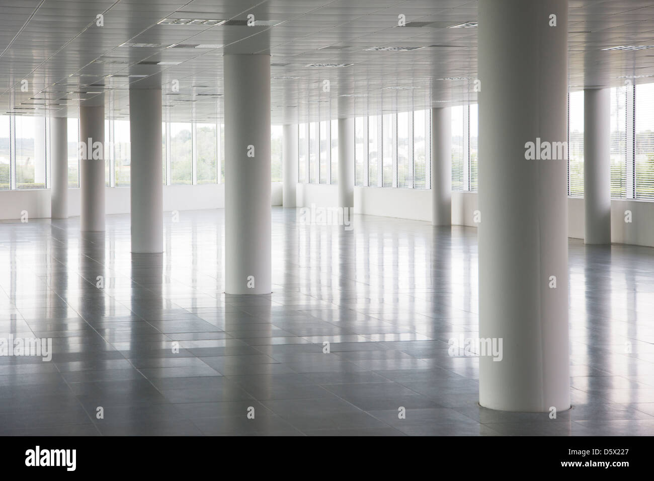 Pillars in empty office building Stock Photo - Alamy