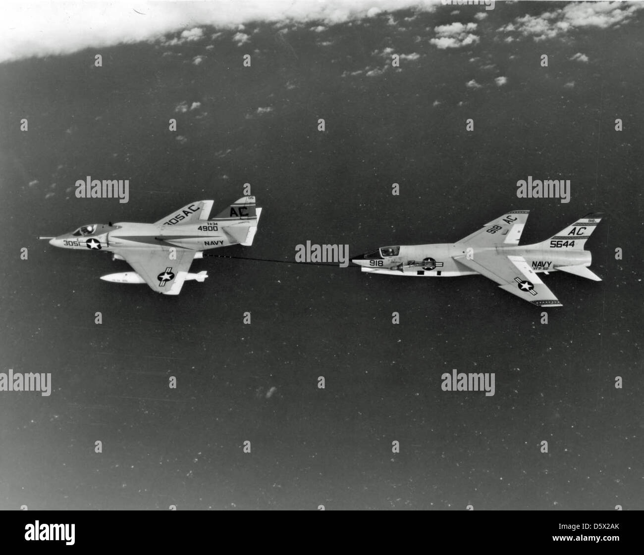 A Douglas A4D-2 'Skyhawk' of Attack Squadron (VA) 34 refuels a Vought ...