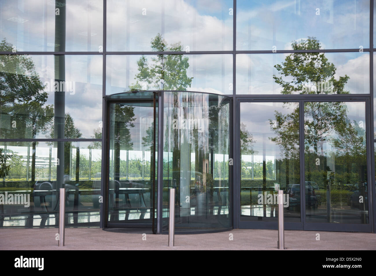 Park reflected in glass windows Stock Photo - Alamy