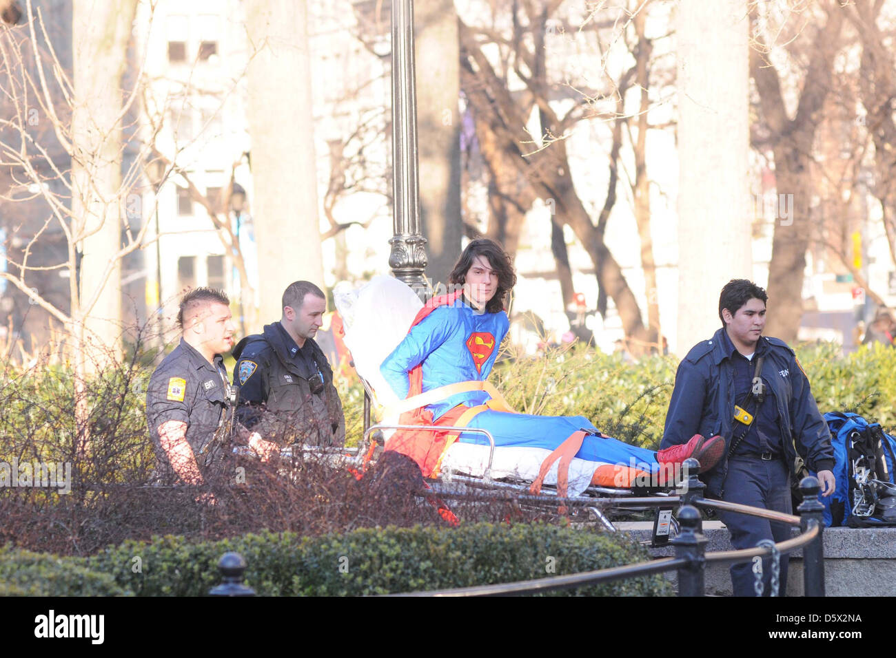 A man dressed in a Superman costume protests against social ...